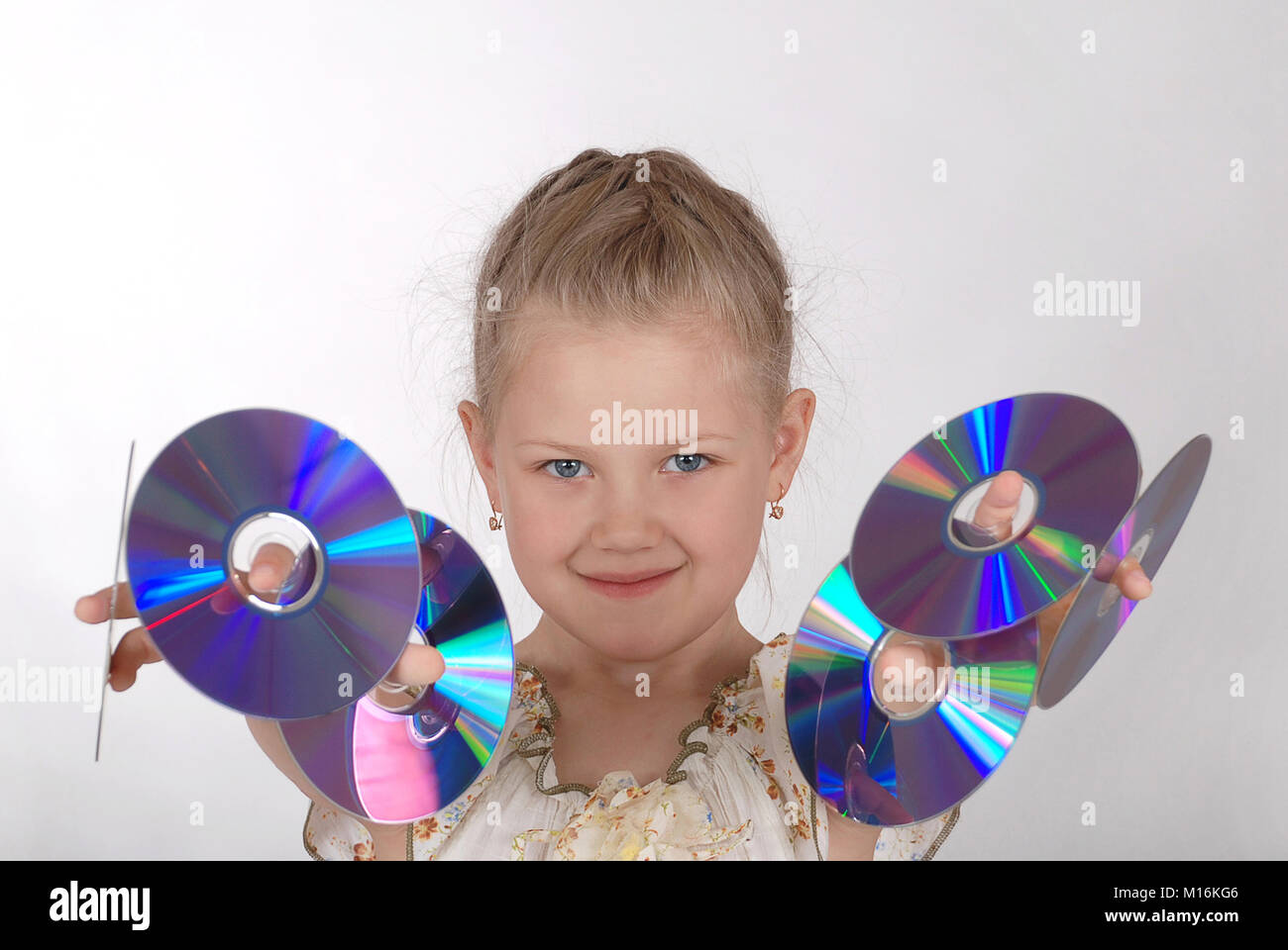 The girl holds CD or DVD Stock Photo - Alamy