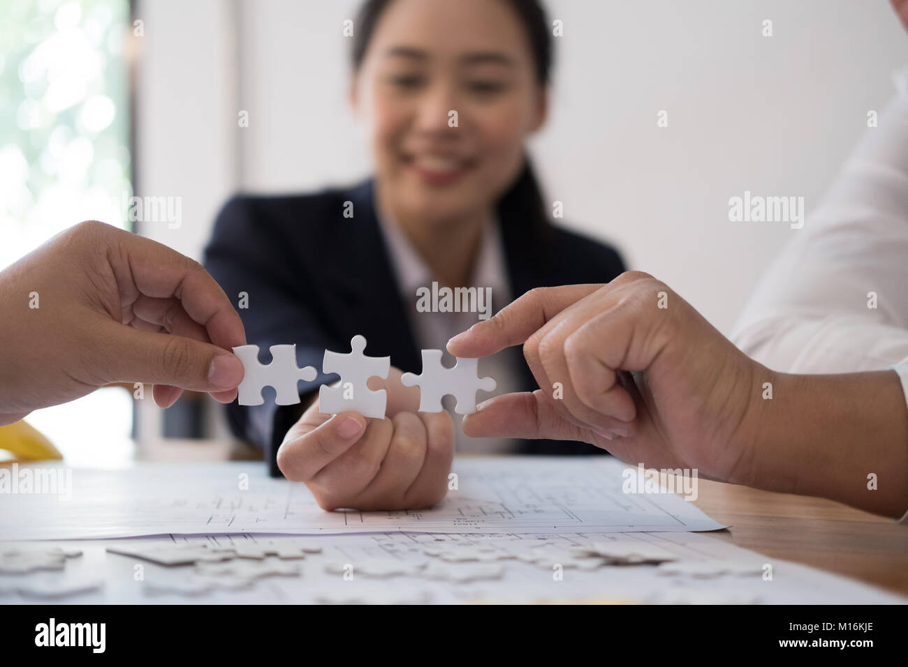 Group business people assembling hi-res stock photography and images ...