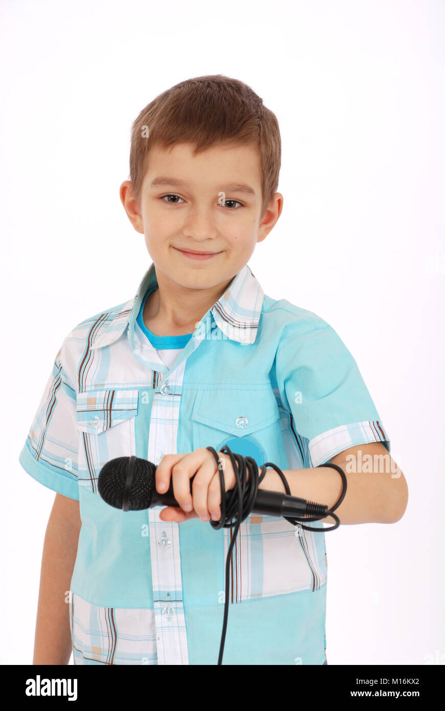 boy showing microphone, isolated on a white background Stock Photo - Alamy