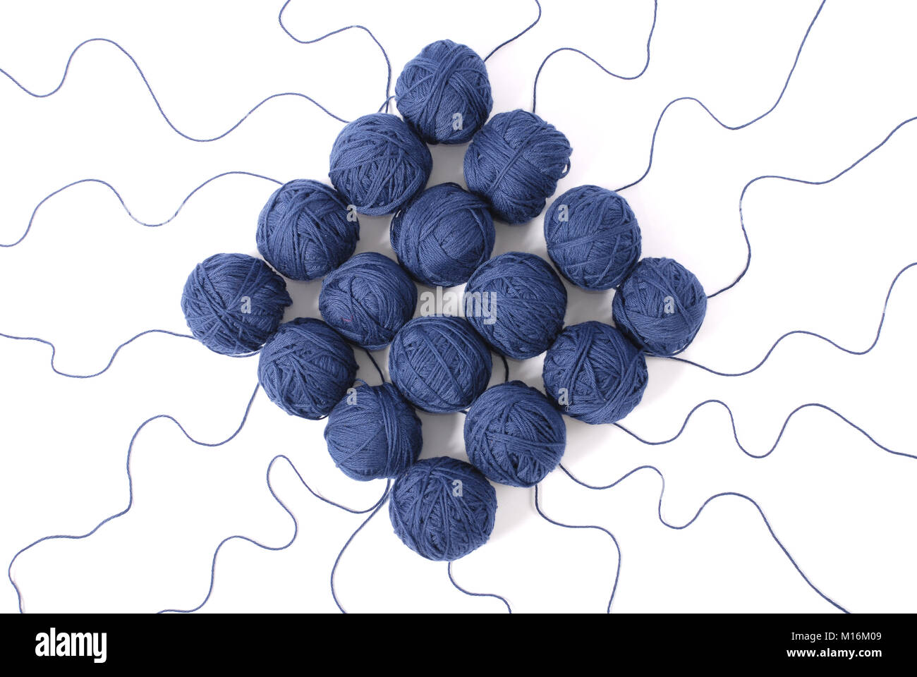 blue threads and clews isolated on a white background Stock Photo - Alamy