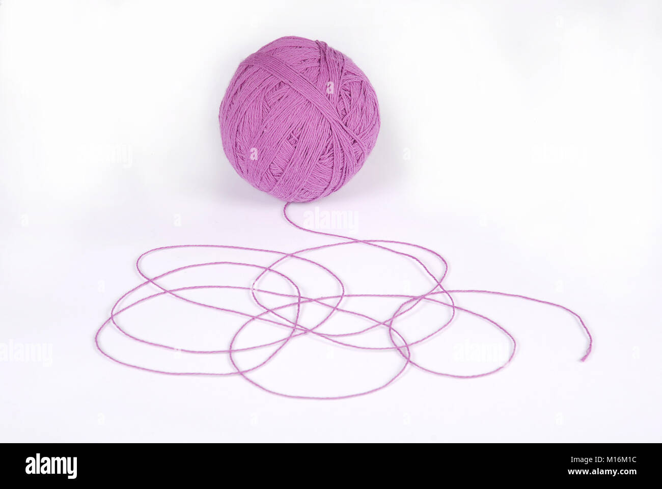 threads clew isolated on a white background Stock Photo - Alamy