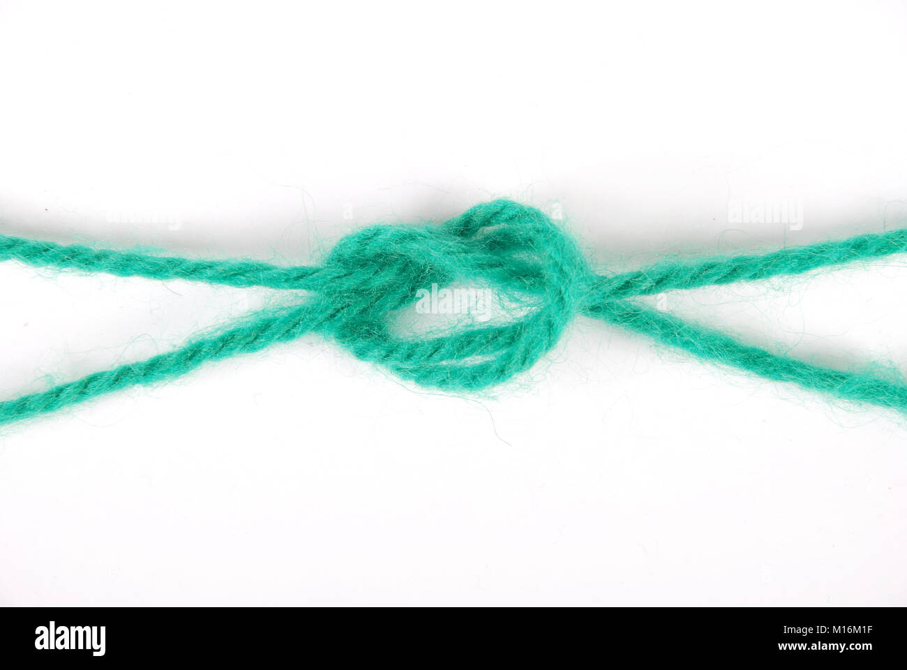 green threads isolated on a white background Stock Photo - Alamy
