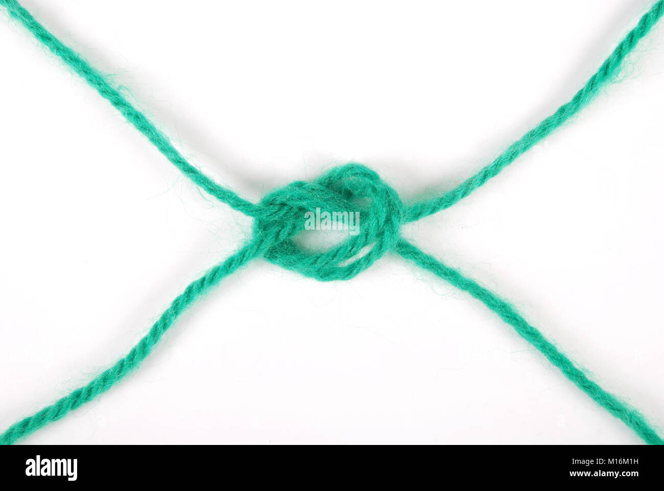 green threads isolated on a white background Stock Photo - Alamy