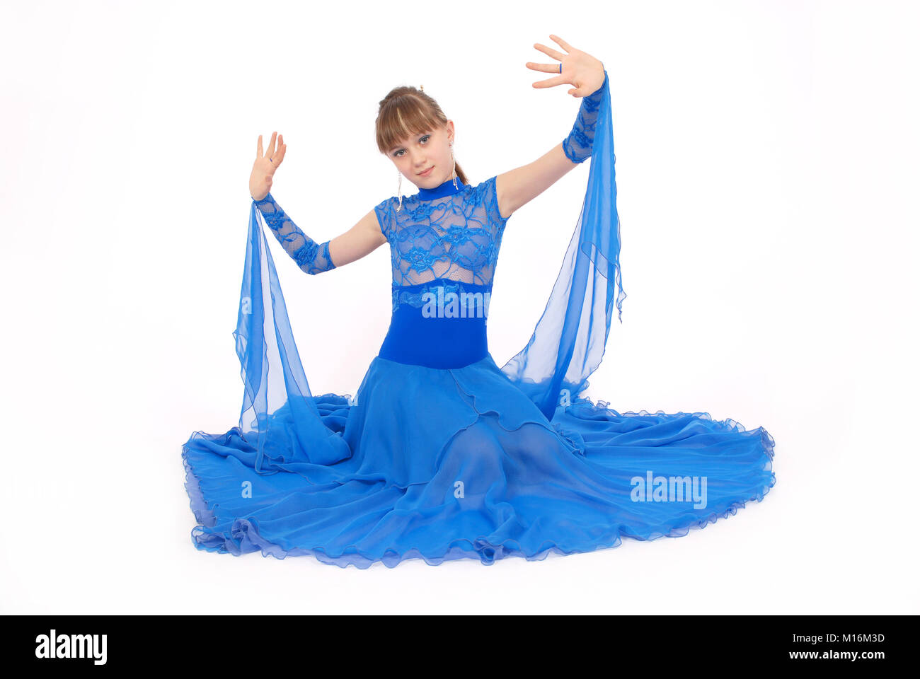 girl in blue dress posing in studio on white background Stock Photo - Alamy