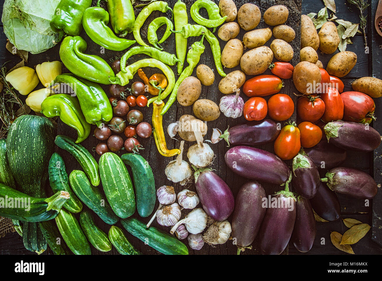 Vegetables on wood. Organic vegetables in rustic setting. Fresh food ...