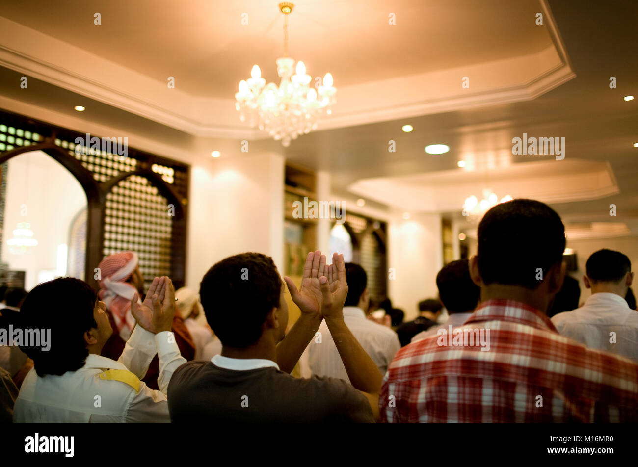 DUBAI, UNITED ARAB EMIRATES - October 17, 2008: Men pray at the Friday ...