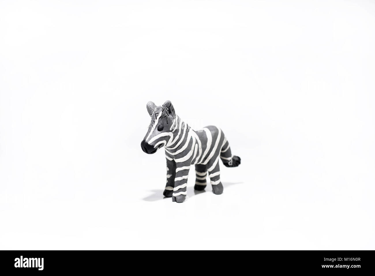 Funny gray Zebra made from Play Clay. Isolated on white background ...