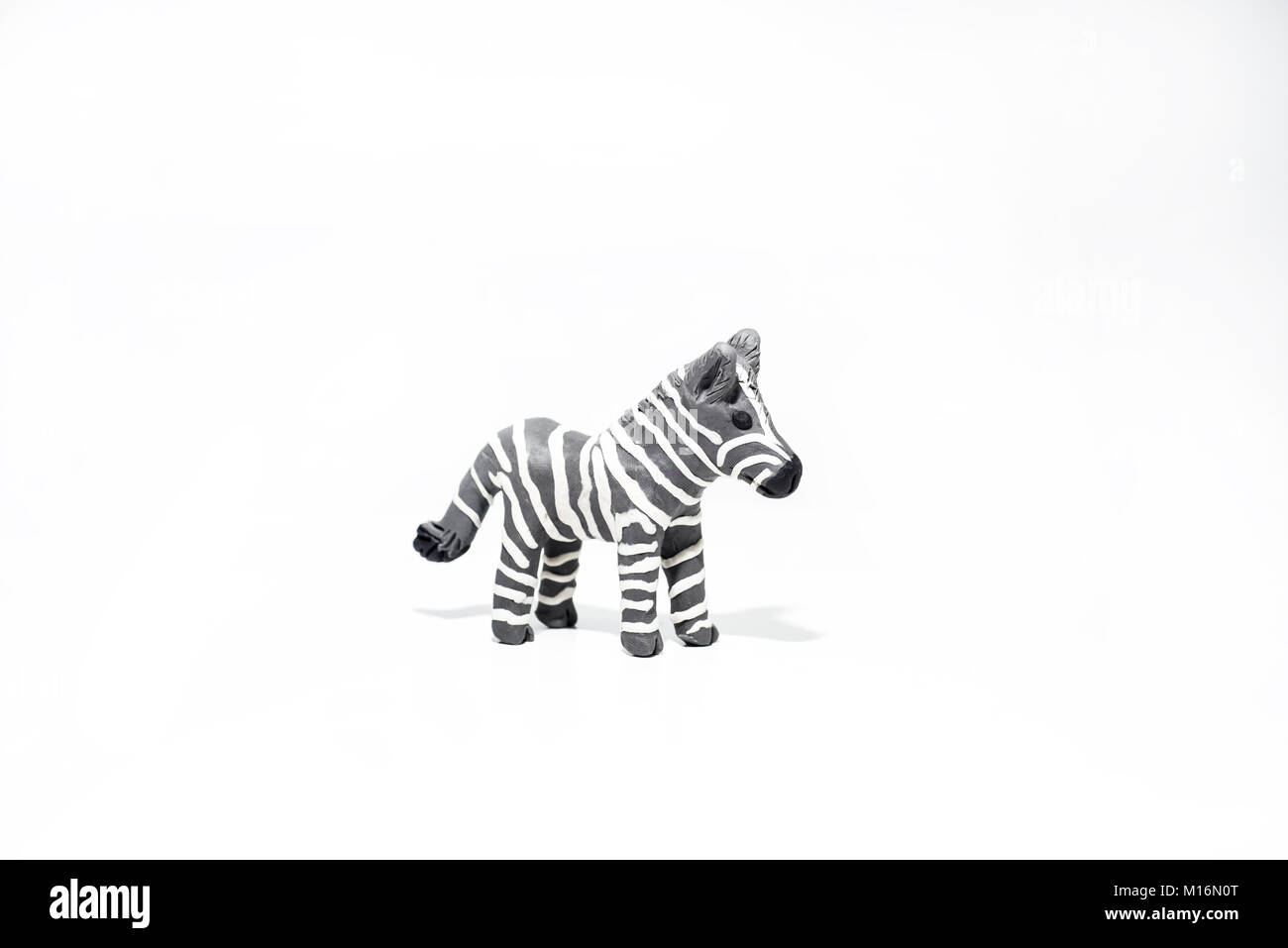 Funny gray Zebra made from Play Clay. Isolated on white background ...