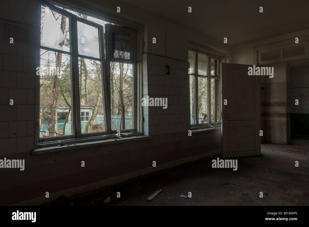 Interior of an abandoned building broken windows Stock Photo - Alamy