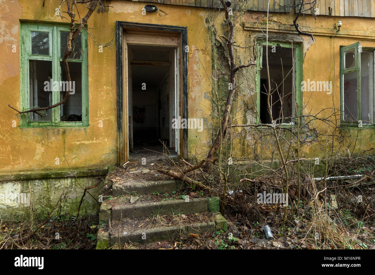 Exterior of an abandoned building broken windows Stock Photo - Alamy