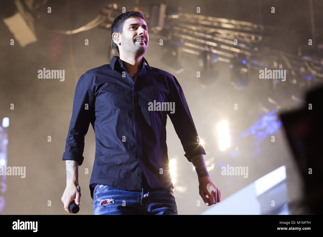 Singer Melendi performing live on stage at the Palacio de los Deportes ...