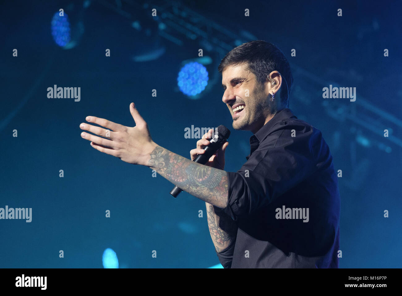 Singer Melendi performing live on stage at the Palacio de los Deportes ...