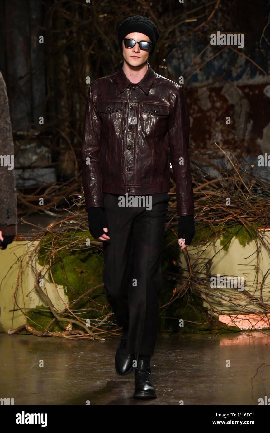 NEW YORK, NY - JANUARY 26: Model walks the runway wearing John Varvatos ...