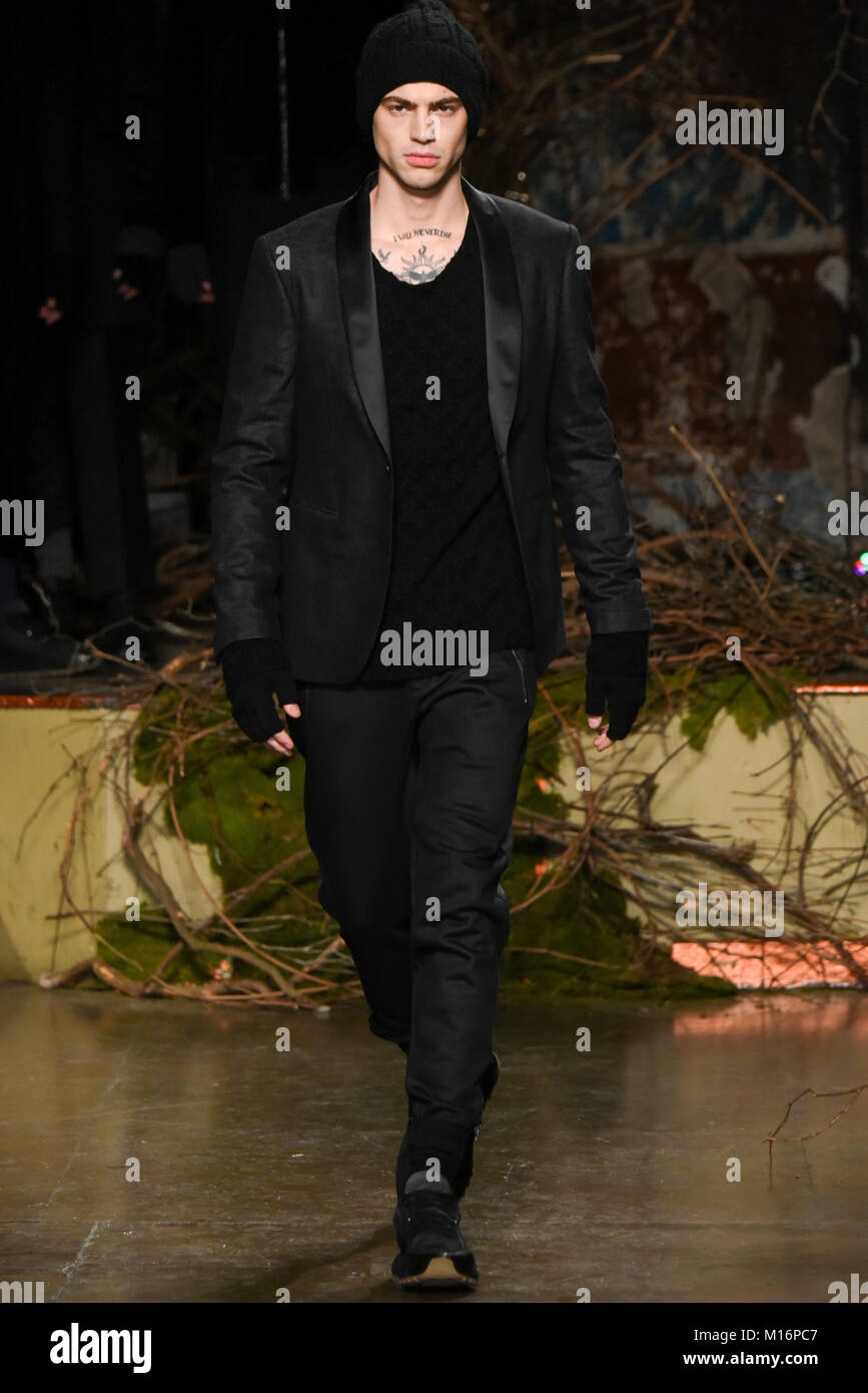 NEW YORK, NY - JANUARY 26: Model walks the runway wearing John Varvatos ...