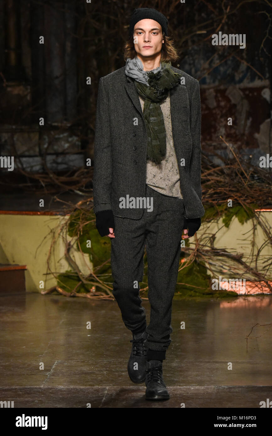 NEW YORK, NY - JANUARY 26: Model walks the runway wearing John Varvatos ...
