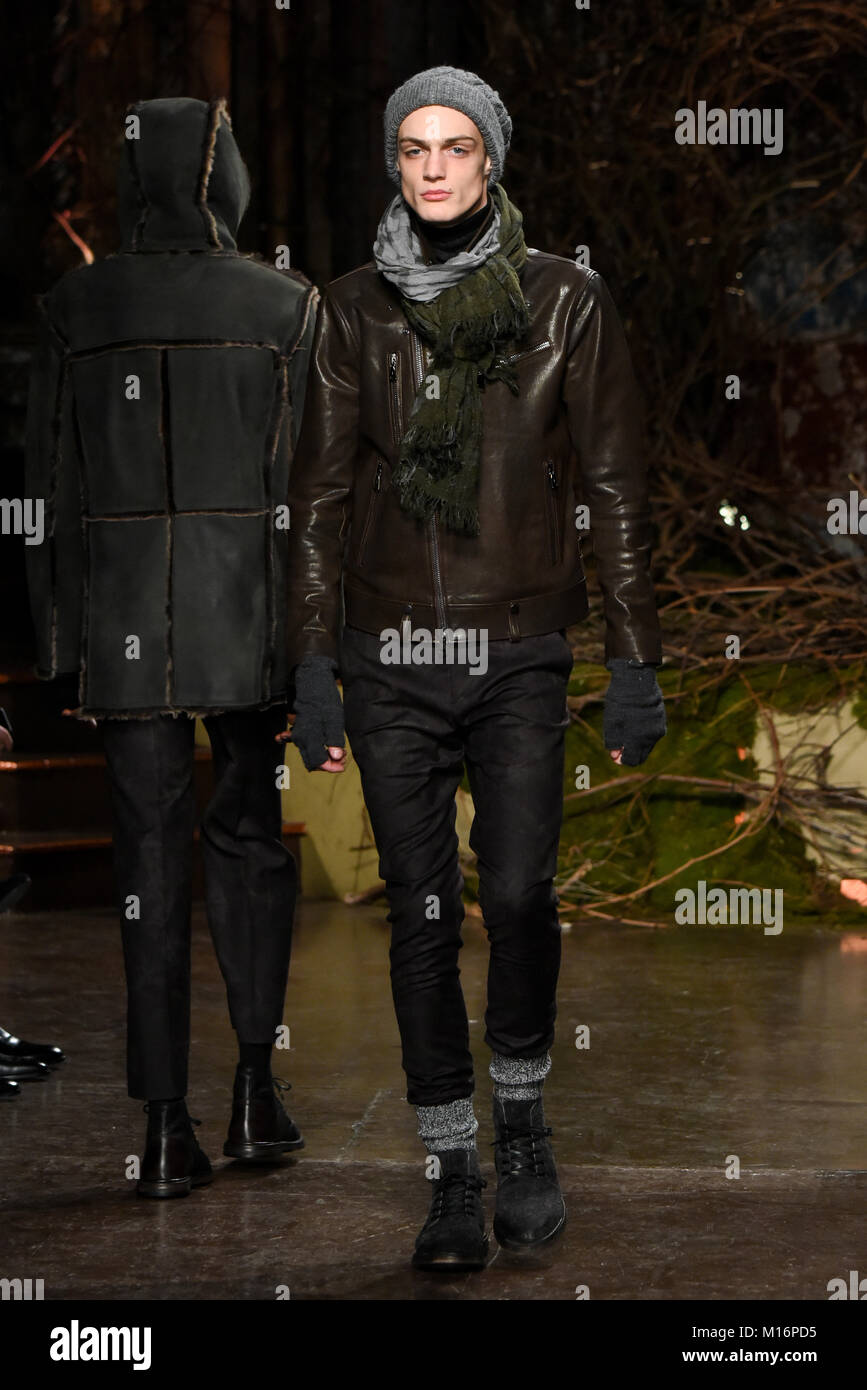 NEW YORK, NY - JANUARY 26: Model walks the runway wearing John Varvatos ...