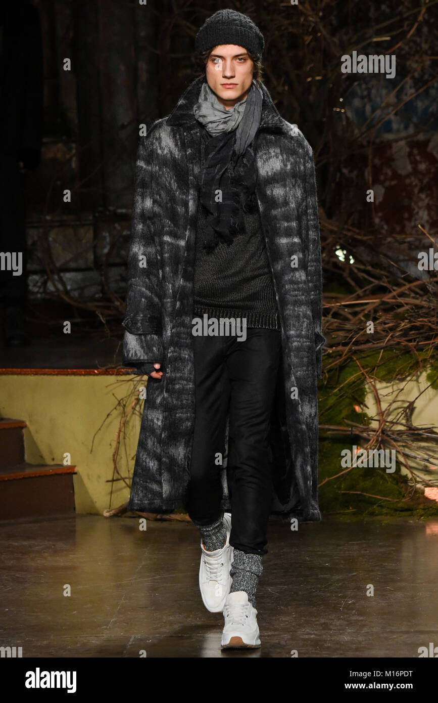 NEW YORK, NY - JANUARY 26: Model walks the runway wearing John Varvatos ...