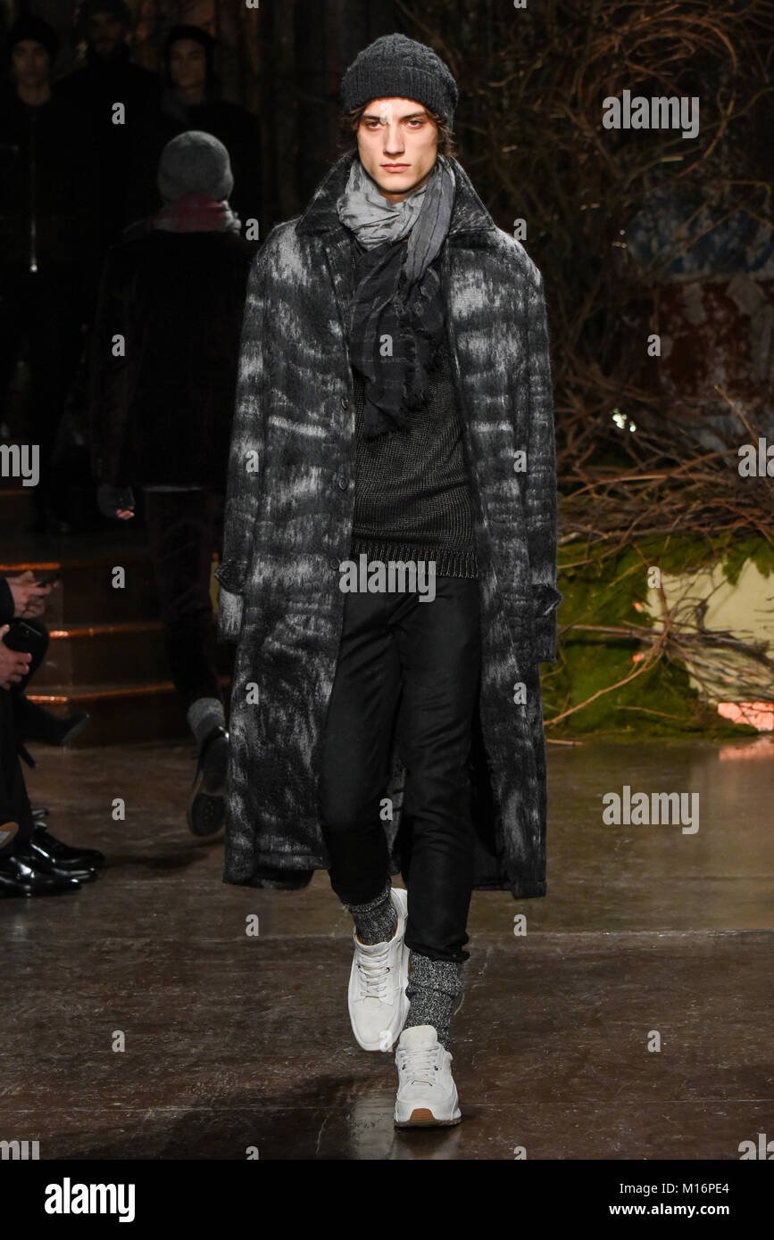 NEW YORK, NY - JANUARY 26: Model walks the runway wearing John Varvatos ...