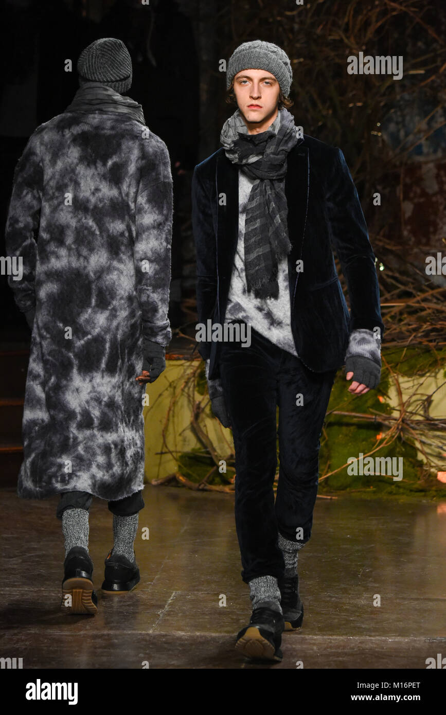 NEW YORK, NY - JANUARY 26: Model walks the runway wearing John Varvatos ...