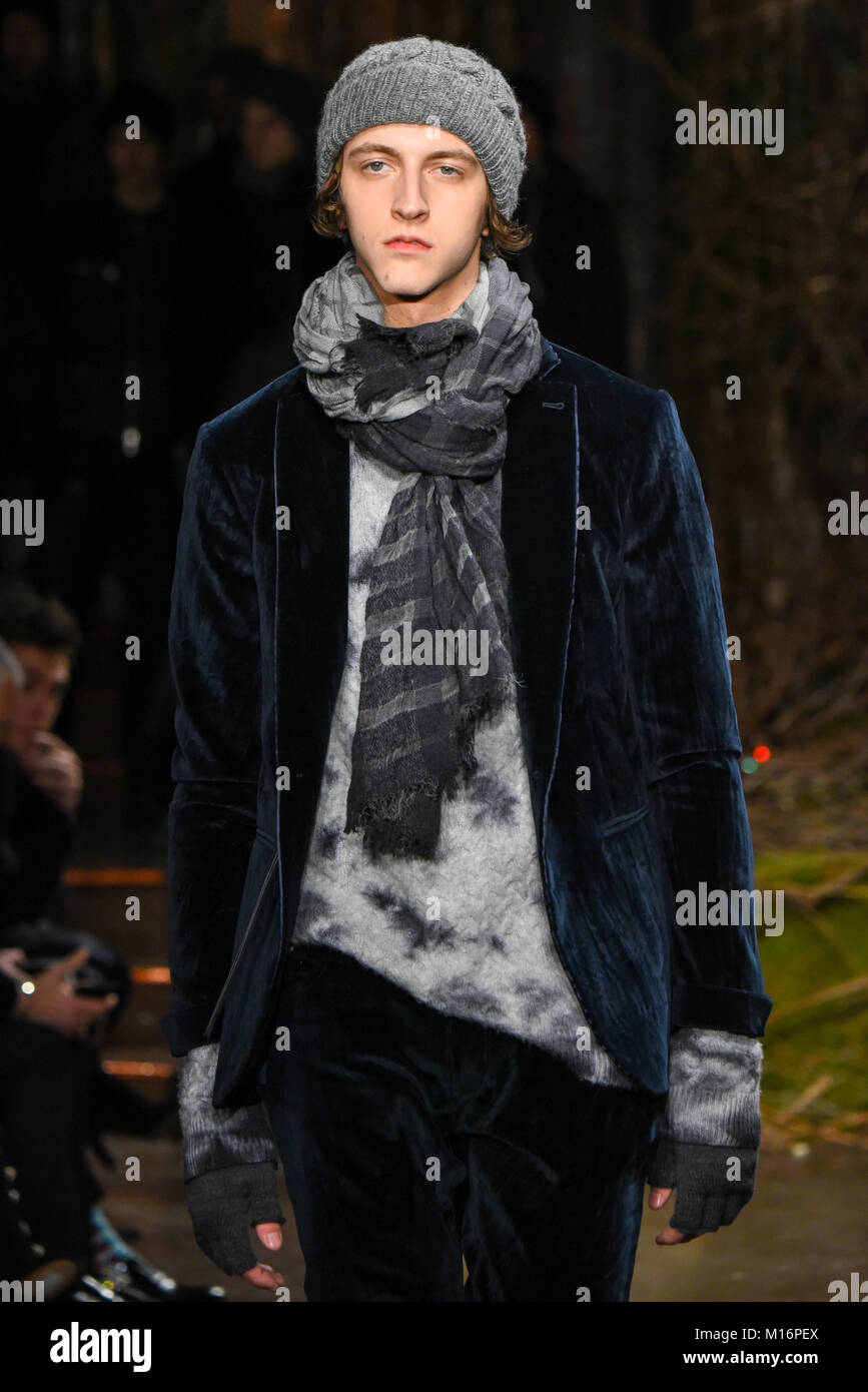 NEW YORK, NY - JANUARY 26: Model walks the runway wearing John Varvatos ...