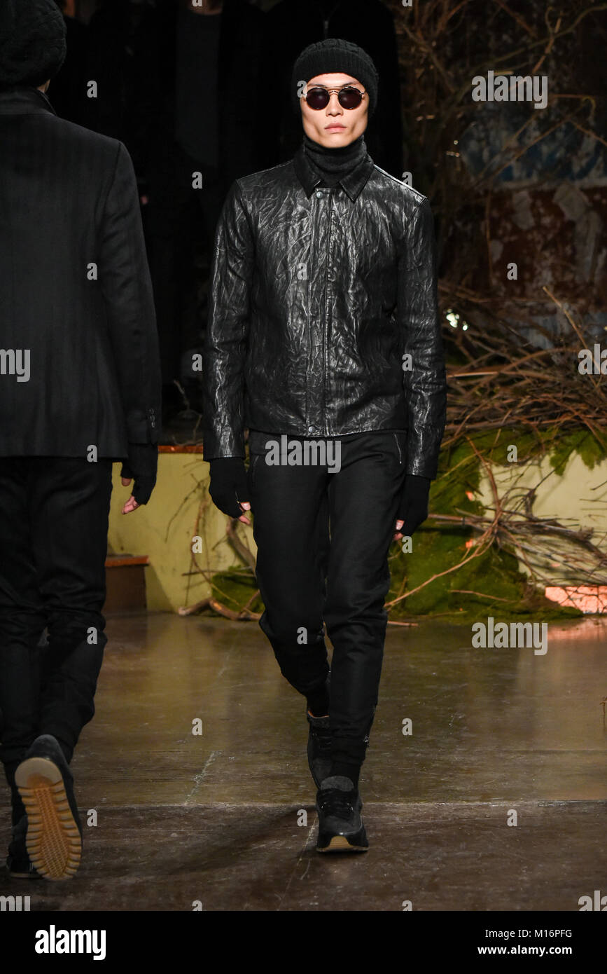 NEW YORK, NY - JANUARY 26: Model walks the runway wearing John Varvatos ...