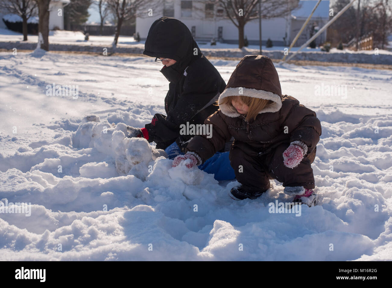 Children playing outside and wearing hats hi-res stock photography and ...