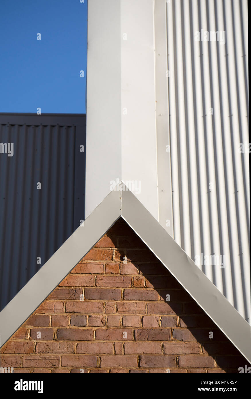 tin and brick roof lines Stock Photo - Alamy