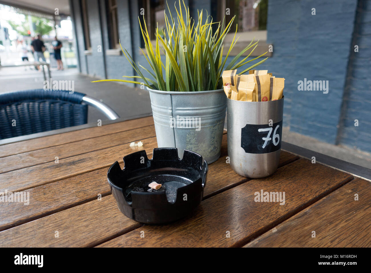 An ashtray on the outdoor table of a cafe in rural Australia Stock ...