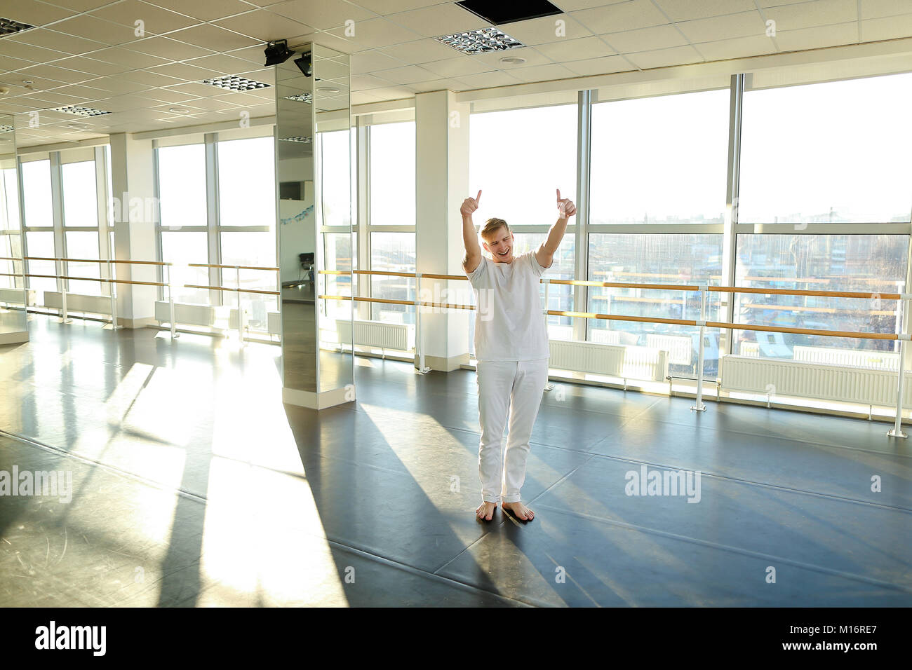 Blonde guy spotting at studio Stock Photo - Alamy