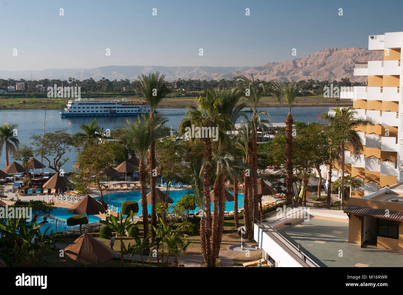 Coral Sea Nile Cruises' vessel Jasmin sails past the Pyramisa Isis ...