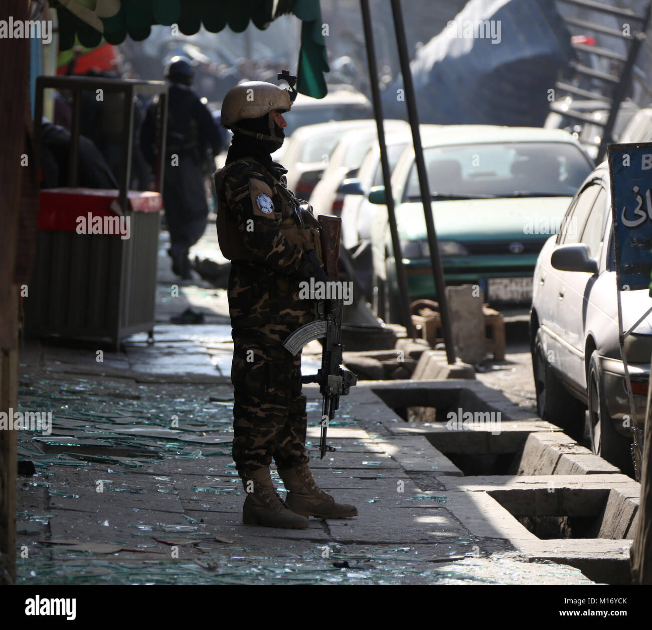 Kabul, Afghanistan. 27th Jan, 2018. A security force member stands ...