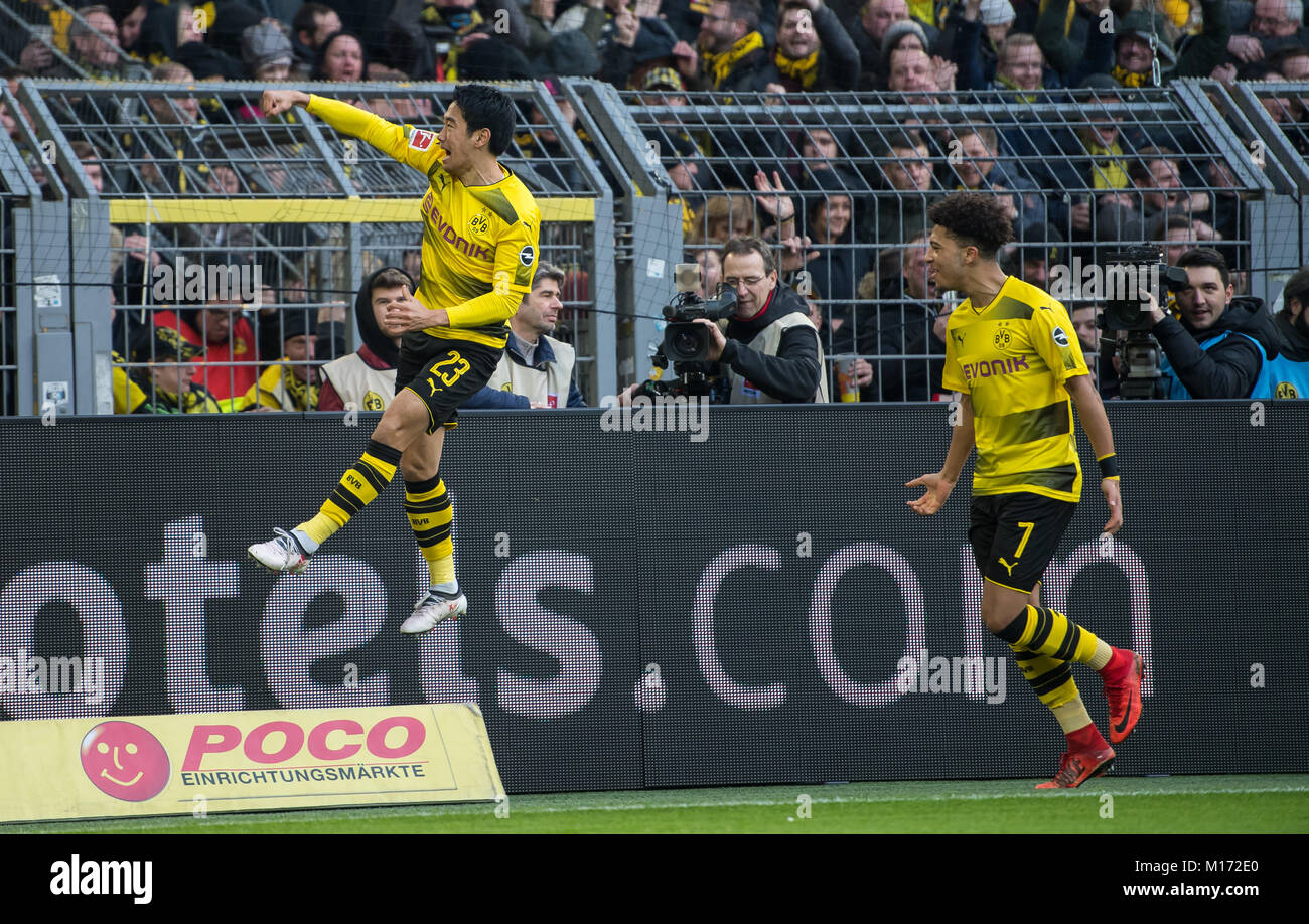 Dortmund's Shinji Kagawa (l) jumps as he celebrates his goal for 1:0 ...
