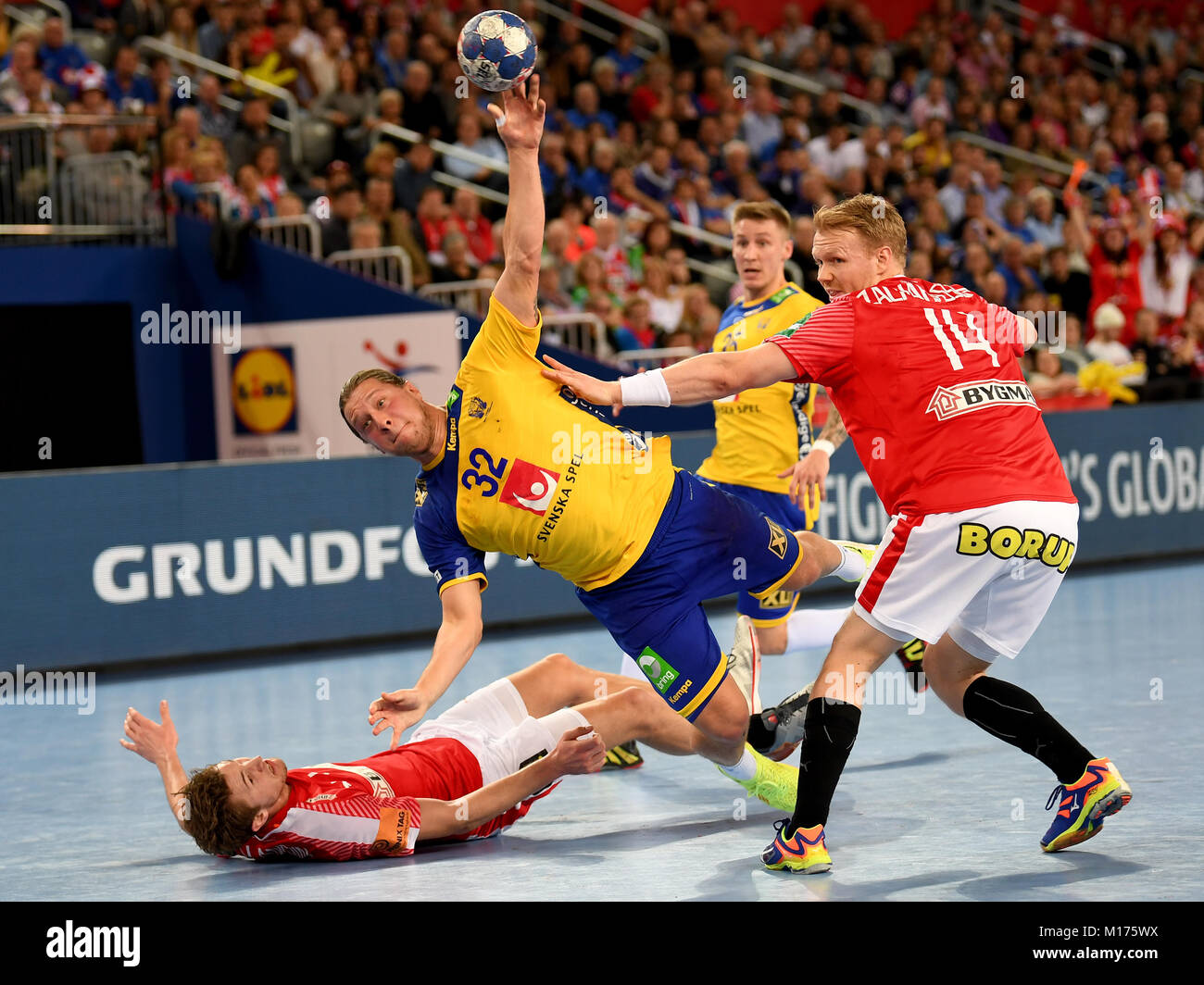 Sweden's Mattias Zachrisson (C) plays against Denmark's Anders ...