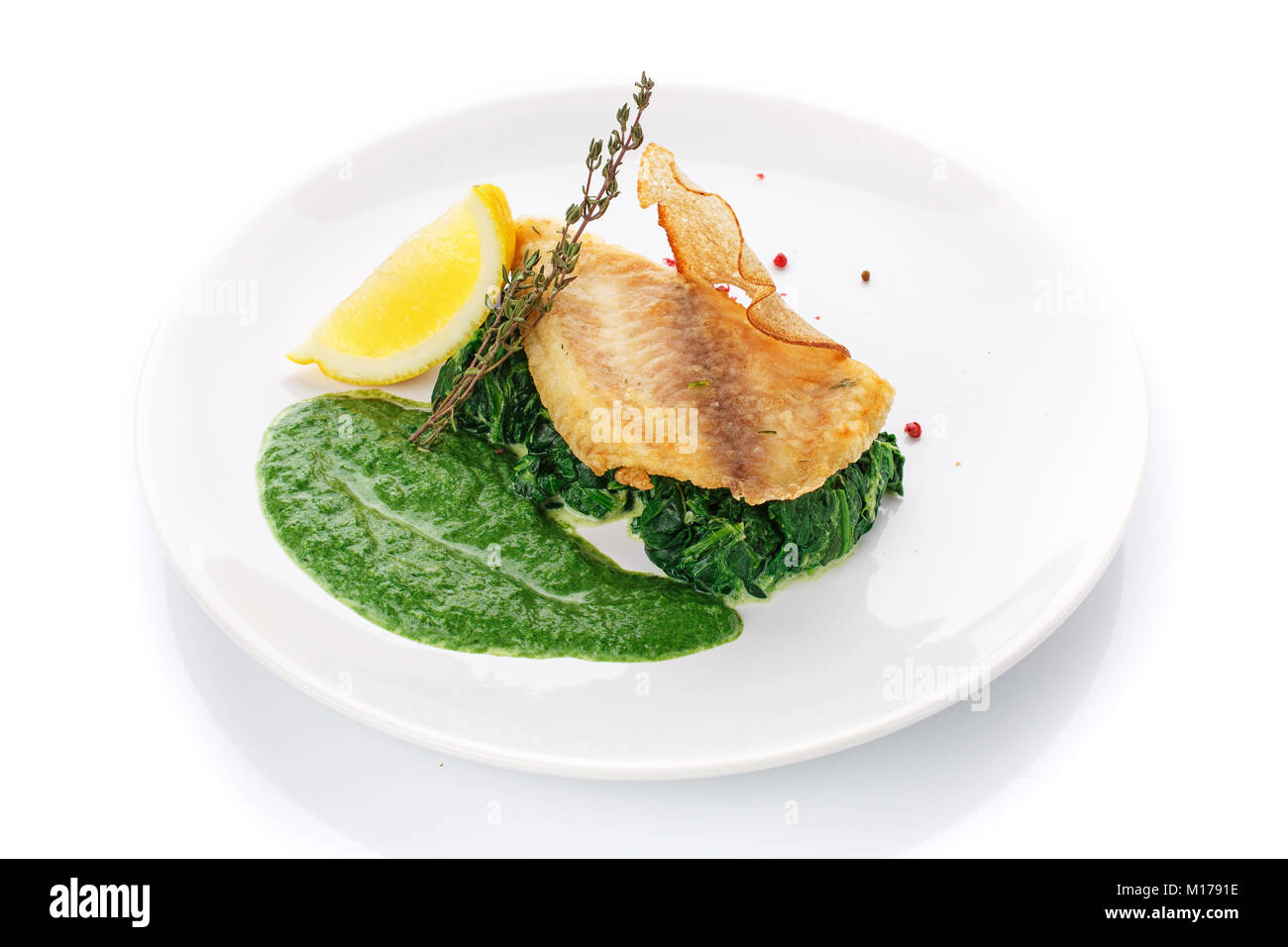 Restaurant food. Delicious lunch. Fish with lemon and herbs Stock Photo ...