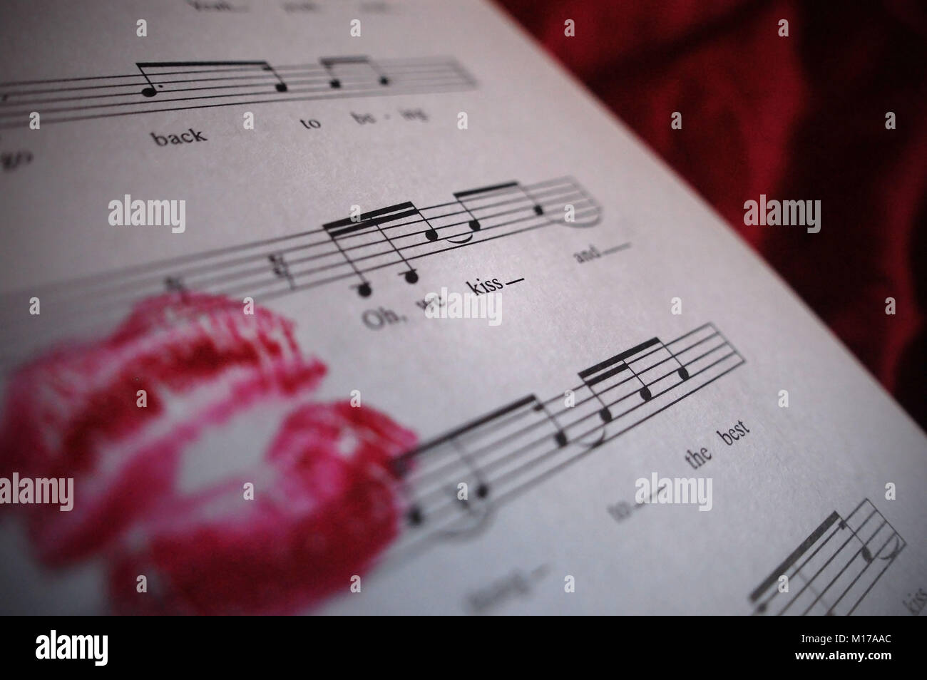 Sheet music adorned with a lipstick kiss Stock Photo - Alamy