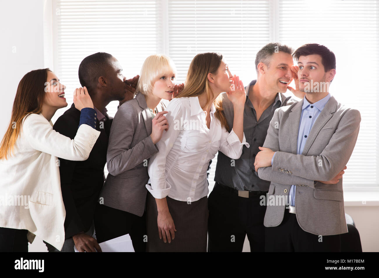 Business Colleague Whispering Secret Gossip To An Amazed Shocked Man ...