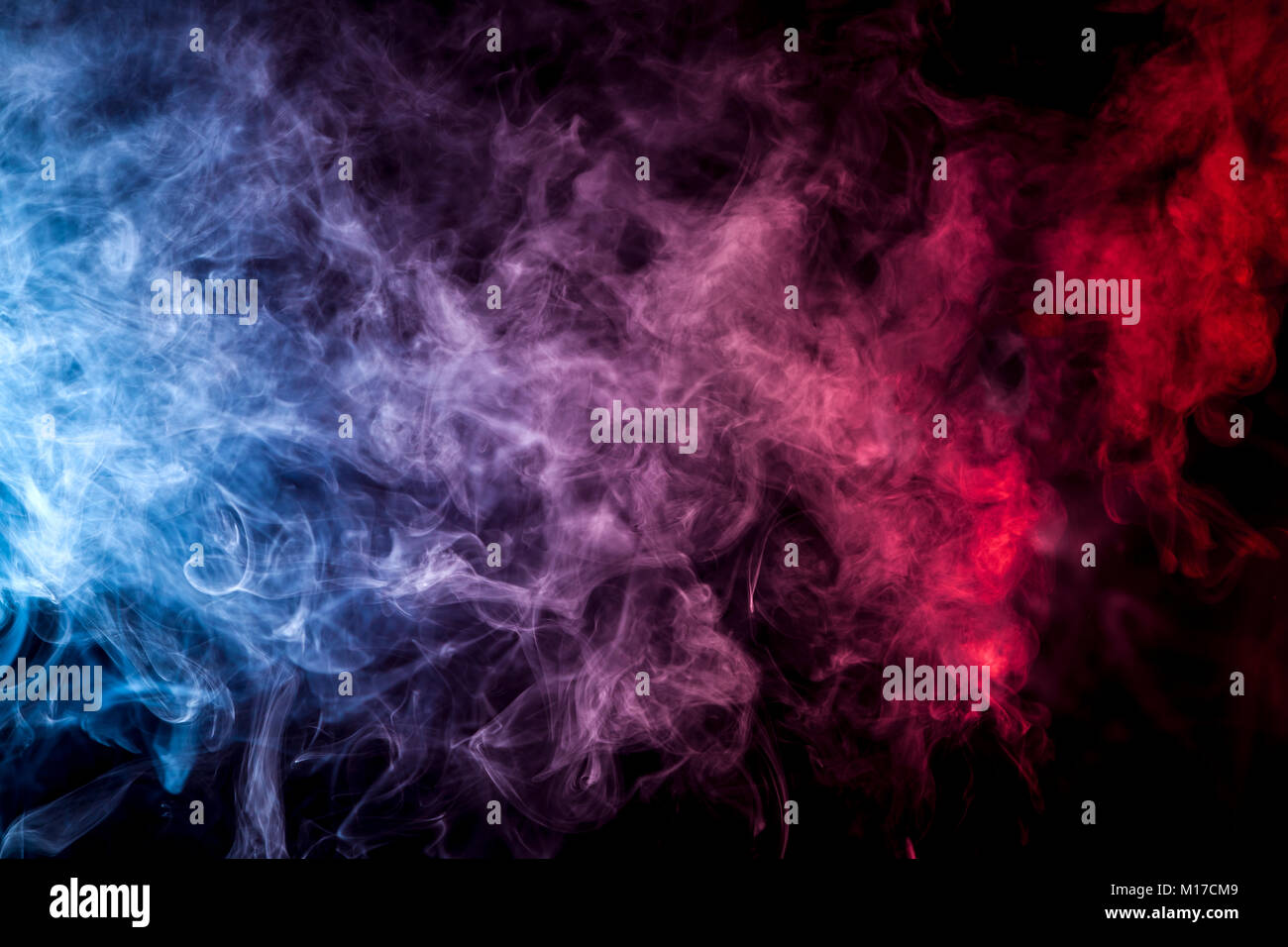 Colorful red and blue smoke clouds on dark background.Background of ...