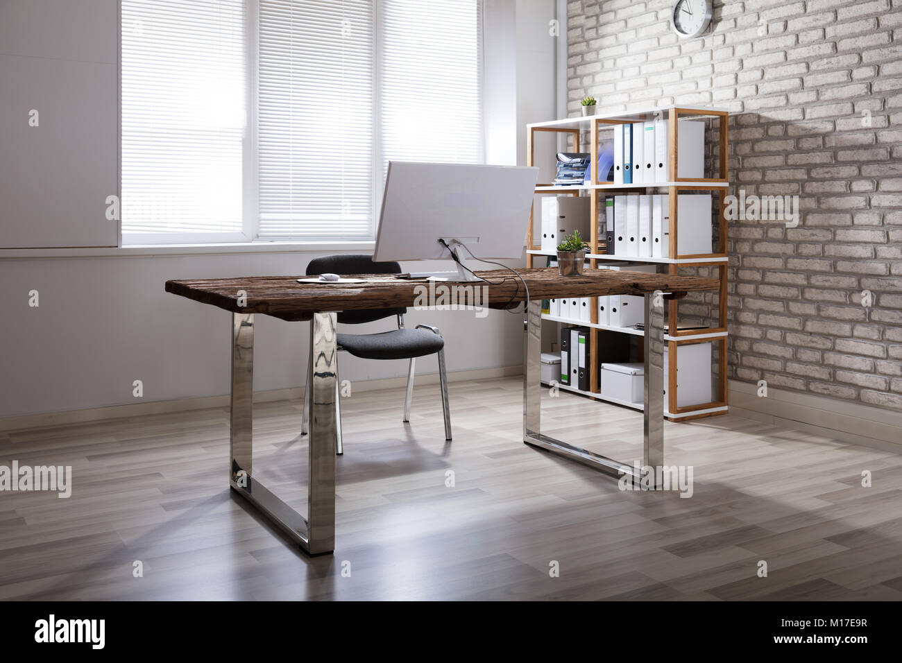 Computer On Desk In Modern Interior Office Stock Photo - Alamy