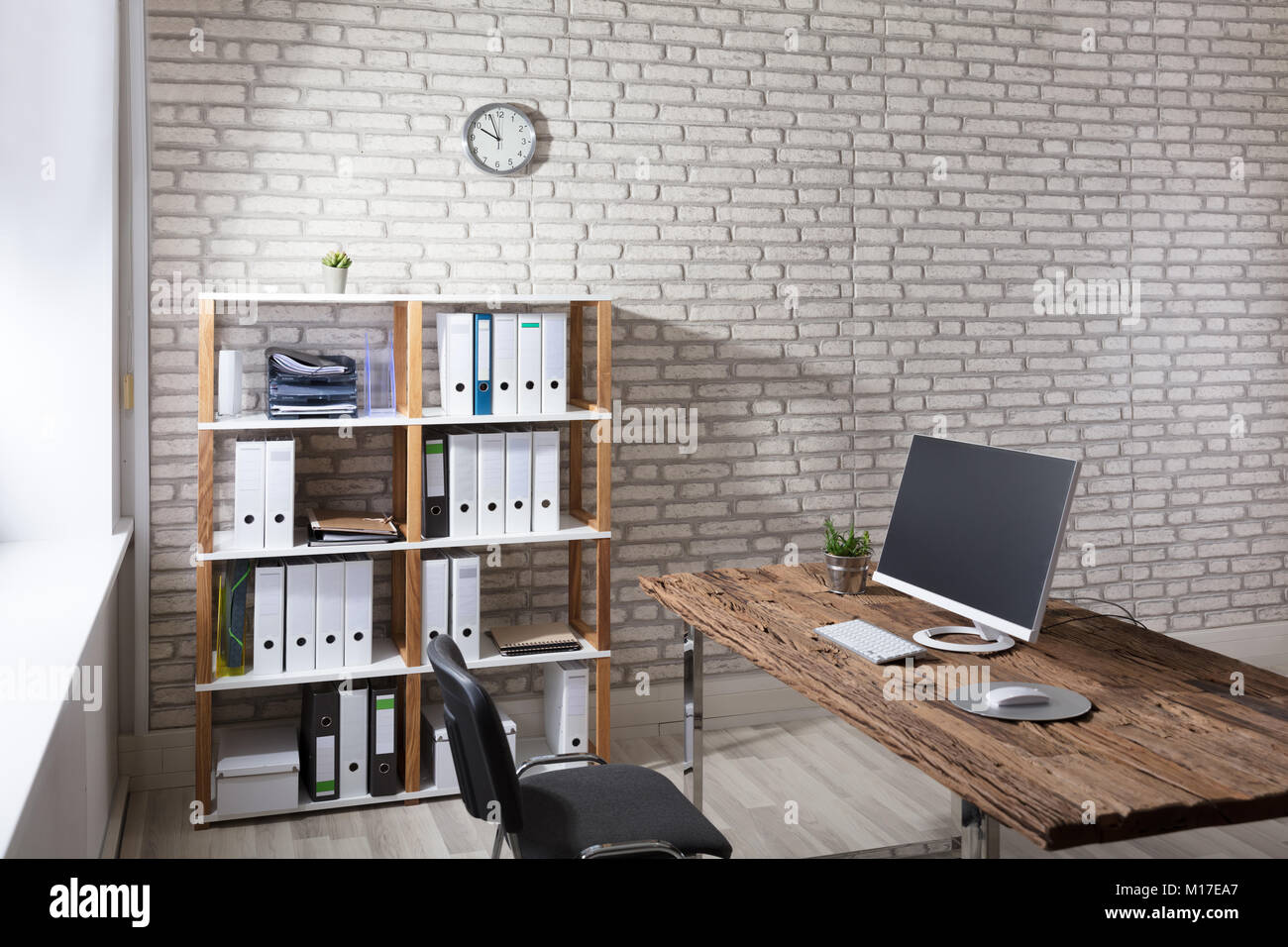 Computer On Desk In Modern Interior Office Stock Photo - Alamy