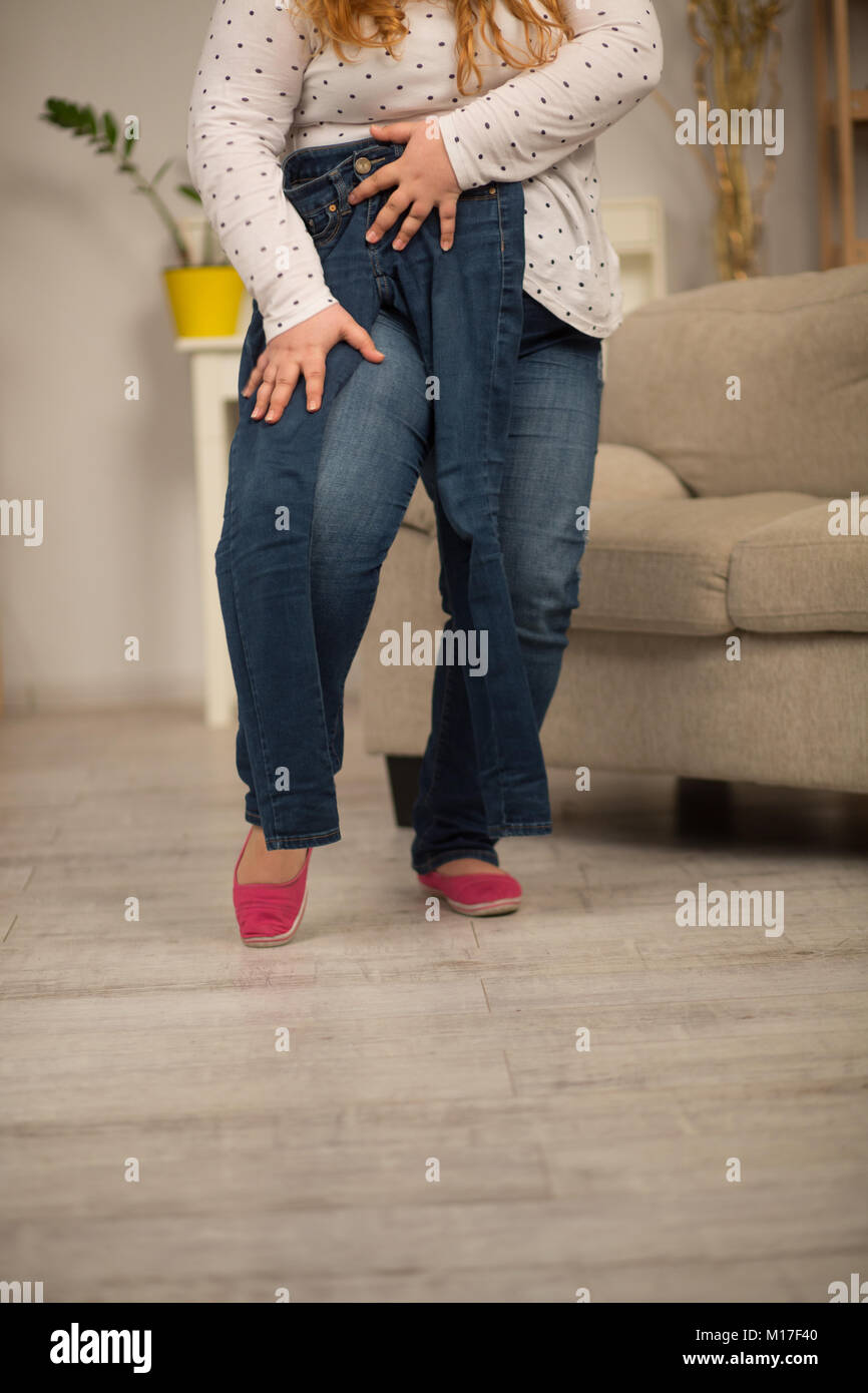 New clothes trying on Stock Photo - Alamy