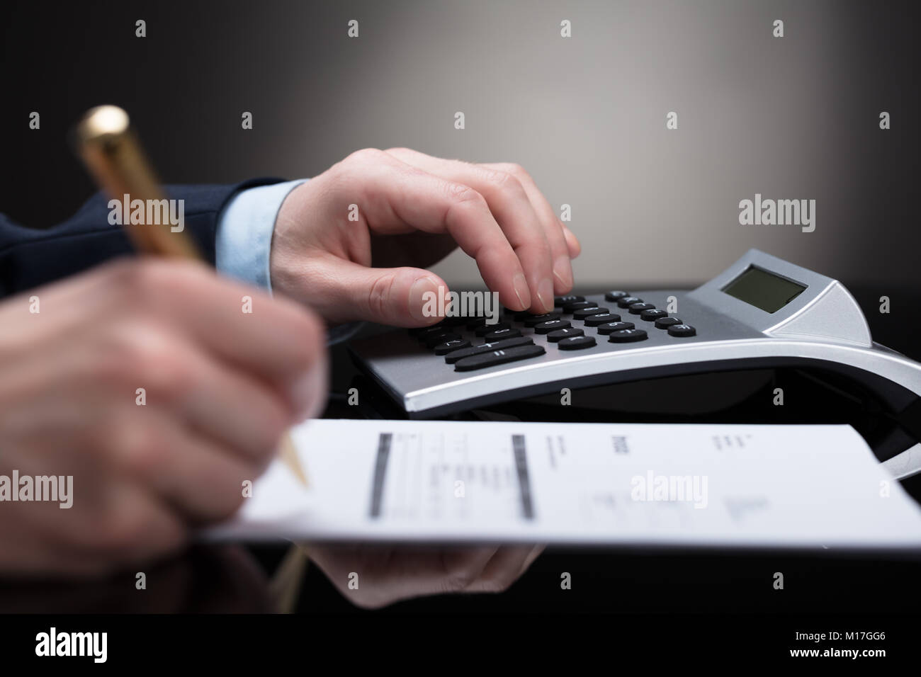 Businessperson Checking Invoice With Receipts On Desk Stock Photo - Alamy