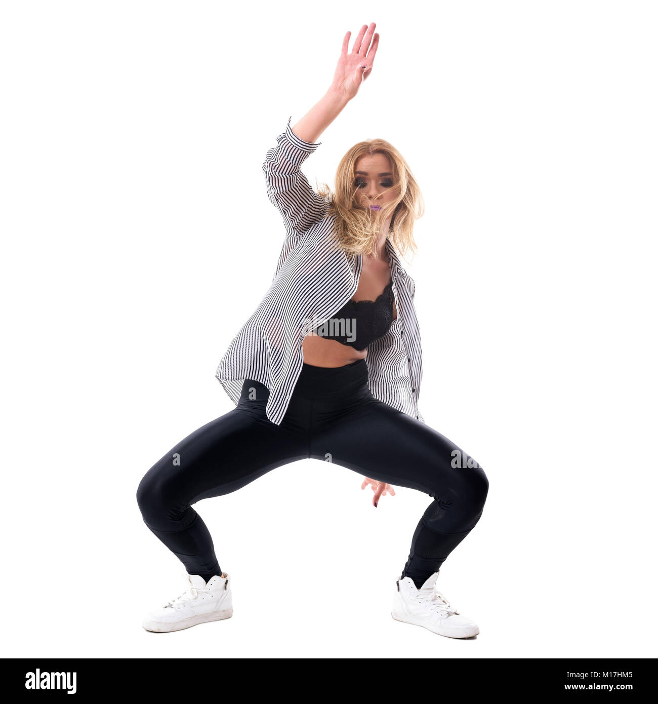 Funky blonde woman dancing dancehall bending backwards with flowing ...
