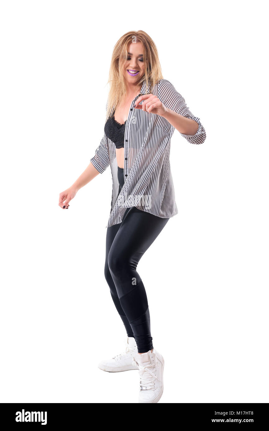 Cheerful smiling excited young funky woman dancing and having fun. Full ...