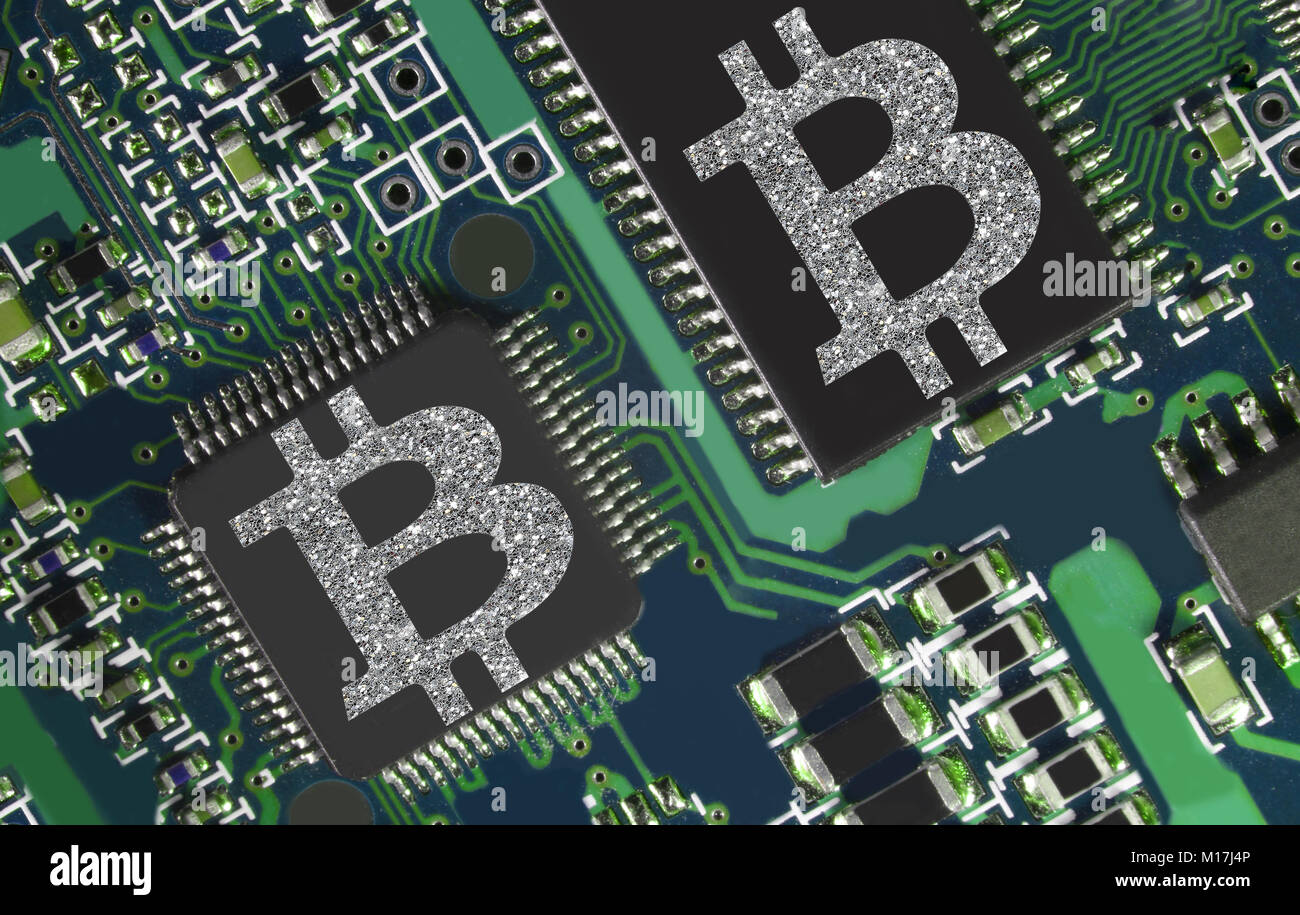 electronic circuit with two big BitCoin silver symbols Stock Photo - Alamy