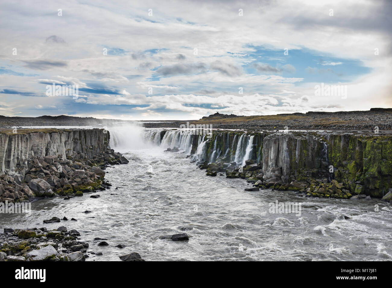 Selfoss waterfalls in Northern Iceland with storm clouds in background ...
