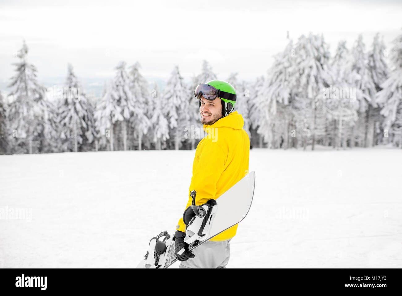 Portrait smiling man winter mountains hi-res stock photography and ...