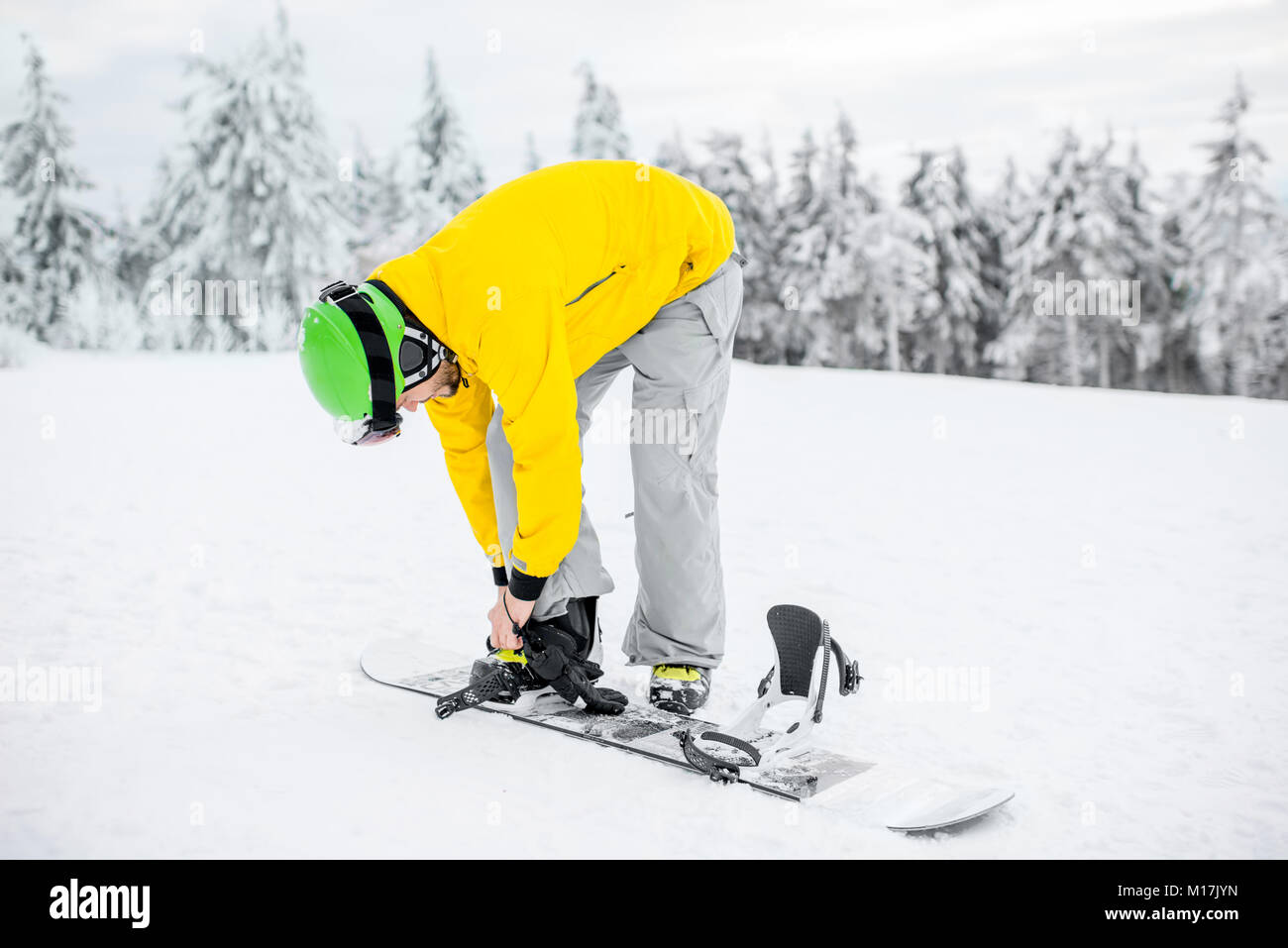 Man wearing a snowboard outdoors Stock Photo - Alamy