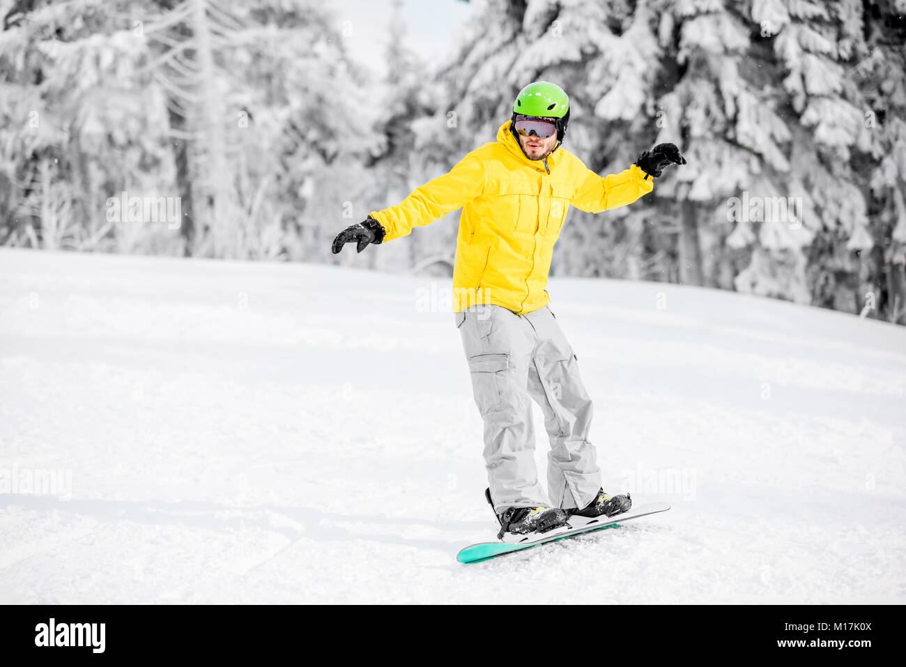 Snowboarding downhill helmet trees hi-res stock photography and images ...