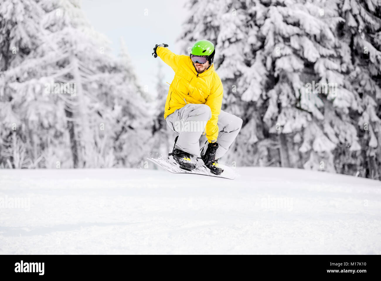 Man snowboarding at the mountains Stock Photo - Alamy