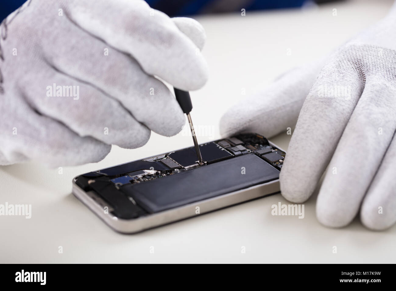 Close-up Of A Human Hand Repairing Smartphone With Screwdriver Stock ...